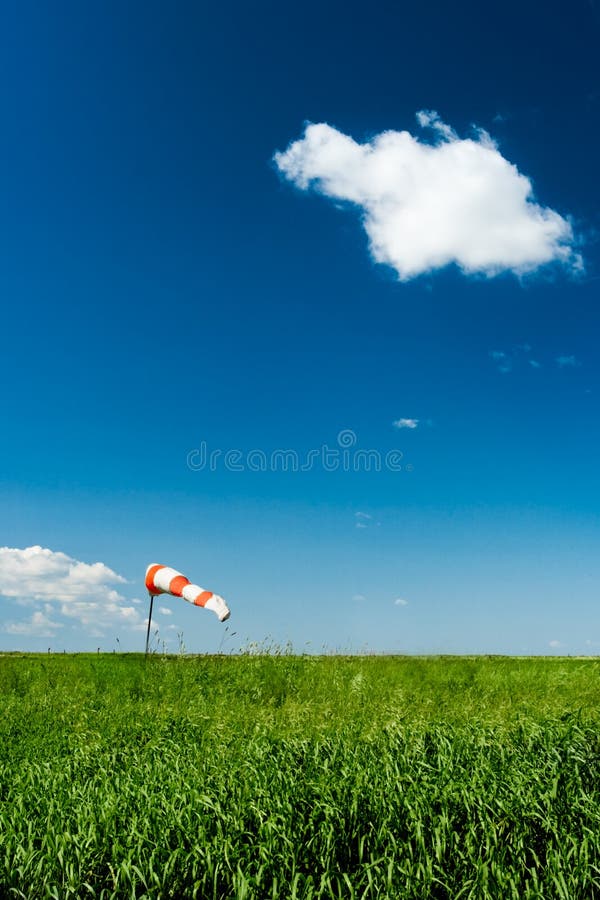 Windsock on green filed stock image. Image of measurement - 10783715