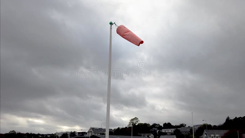 Windsock on Post with Cloudy and Stormy Sky in the Background Stock ...