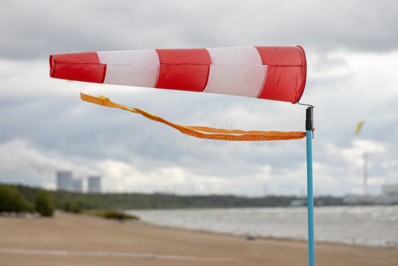 Windsock on a Sandy Beach in Strong Wind, Red and White Fabric Cone ...