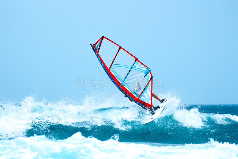 Surfer with Red and Blue Sail Stock Photo - Image of maldives, bahamas ...