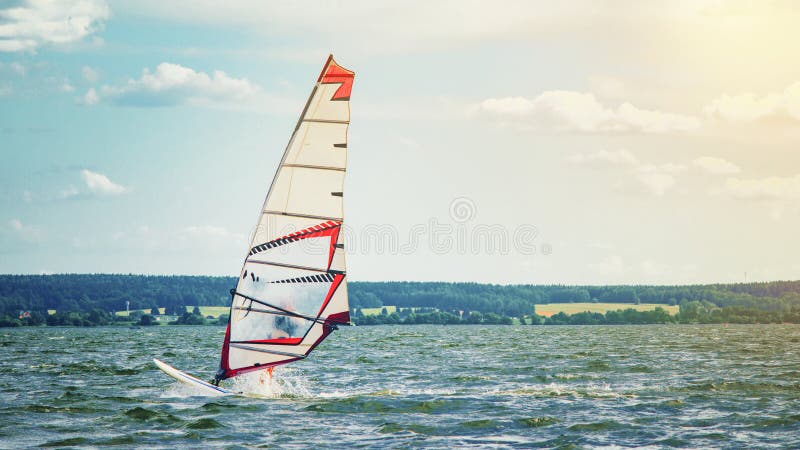 Alone Windsurfer Catches the Wind Stock Image - Image of blue, action ...