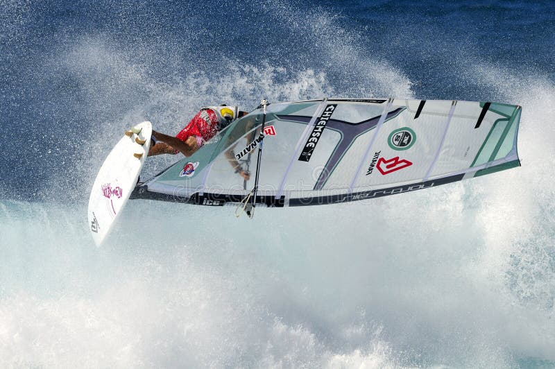 Windsurfer flying on wave editorial photography. Image of windsurfer ...