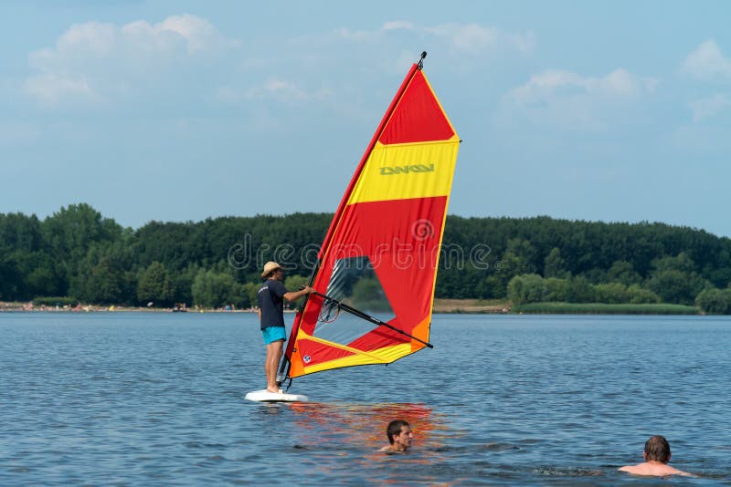 Windsurfer on the lake editorial photography. Image of freedom - 39376777