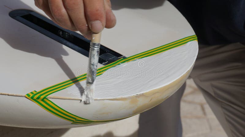 Surf Repair Professional Working on a Surfboard Stock Photo - Image of ...