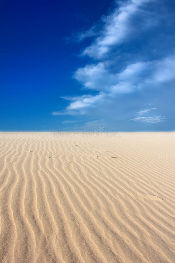 Windswept Sand Dunes on a Blue Sky Stock Photo - Image of alone, escape ...