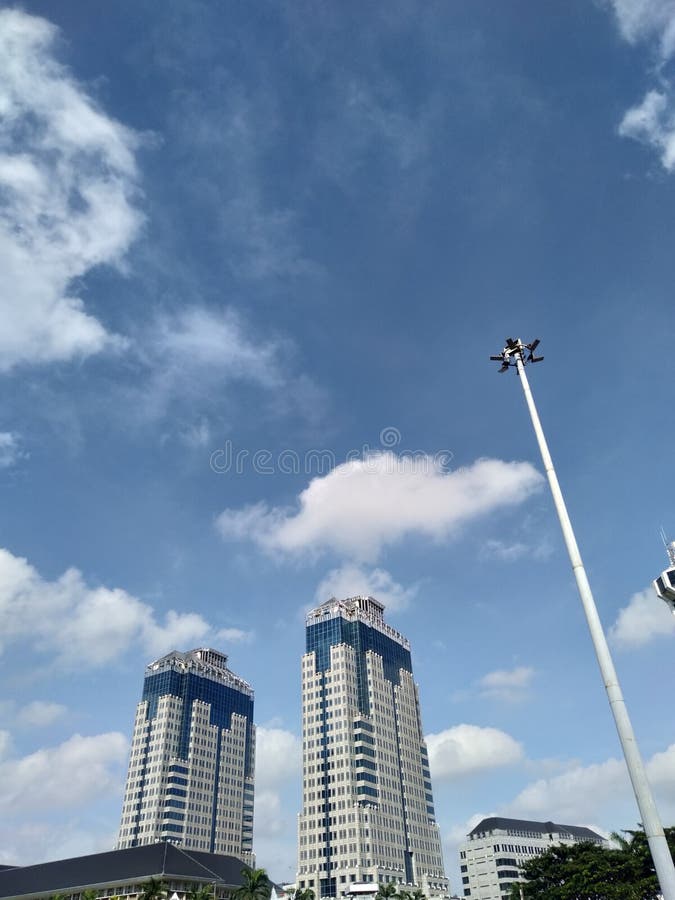 The Windy Blue Sky and the Buildings at the City Stock Image - Image of ...