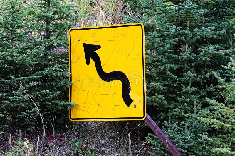 A Windy Road Ahead Sign that Has Been Tipped Over Stock Photo - Image ...