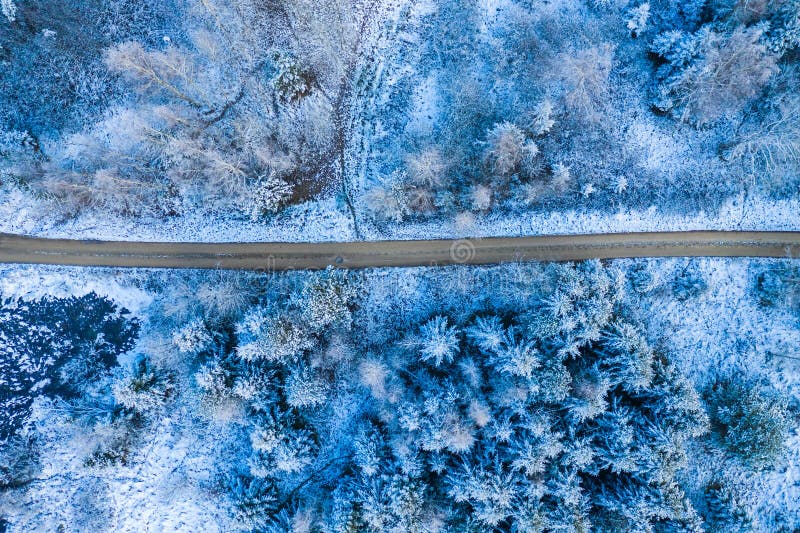 Windy Winter Road in Snow Covered Forest, Top Down Aerial View. Stock ...