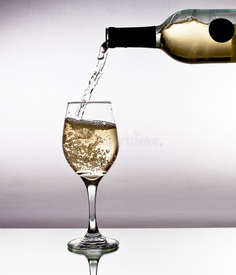White Wine Being Poured stock photo. Image of wine, isolated - 10150382