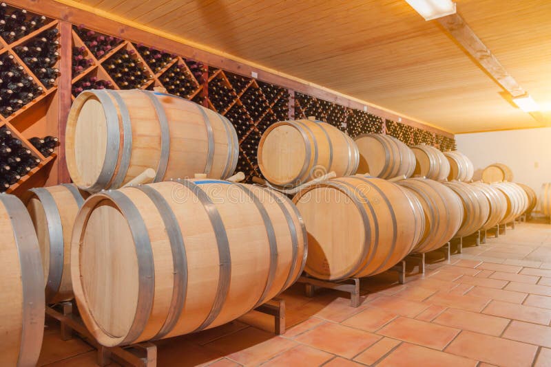 Wine Barrels and Bottles Age Inside Cellar Stock Photo - Image of ...