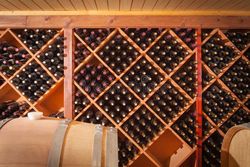 Wine Barrels and Bottles Age Inside Cellar Stock Photo - Image of ...