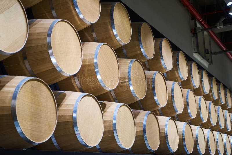 Wine Barrels in Wine-vaults in Order, Close-up. Stacked Wine Barrels ...