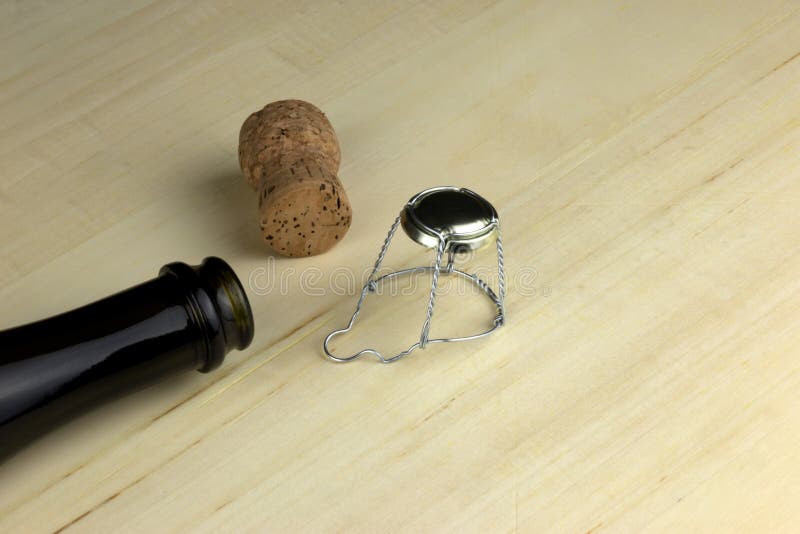 Wine Bottle with Cork and Wire Retainer on Wooden Table Top Stock Photo ...