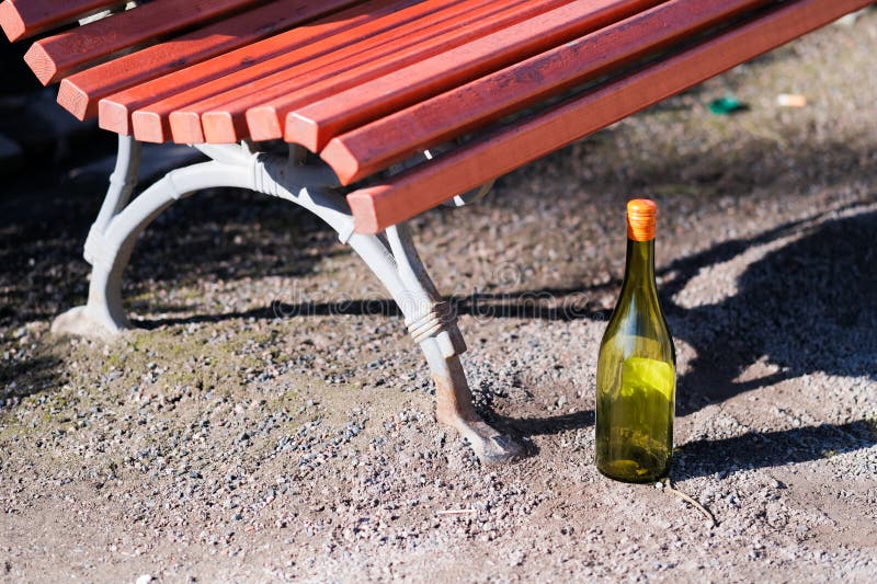 Wine Bottle at a Park Bench Stock Image - Image of danger, outside ...