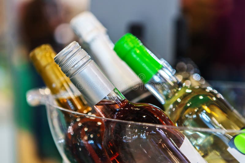 Wine in Bottles of Different Colors and Types in a Glass Vase for ...