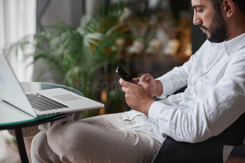 Wine Business Owner Reading a Message on His Smartphone. Stock Image ...