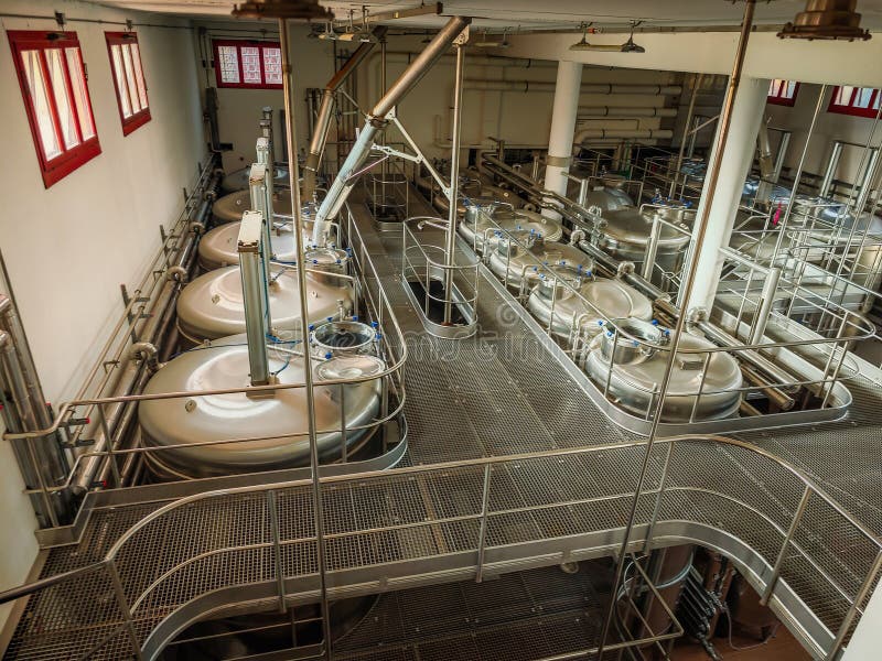 Inside a Winery. Wine Cellar with with Steel Barrels for Fermentation ...