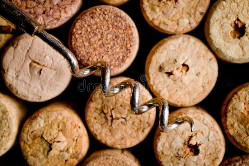 Wine Corks of Different Sizes and a Corkscrew Standing Upright on an ...