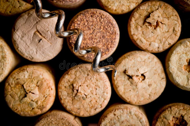 Wine Corks of Different Sizes and a Corkscrew Standing Upright on an ...