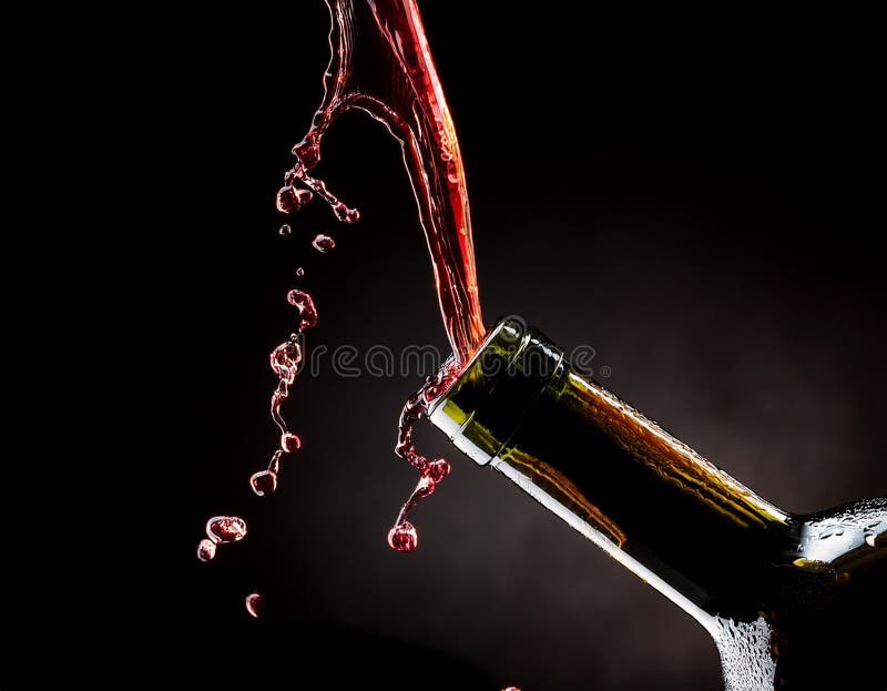 Wine Drops Falling from a Tilted Bottle Captured Mid-action To ...