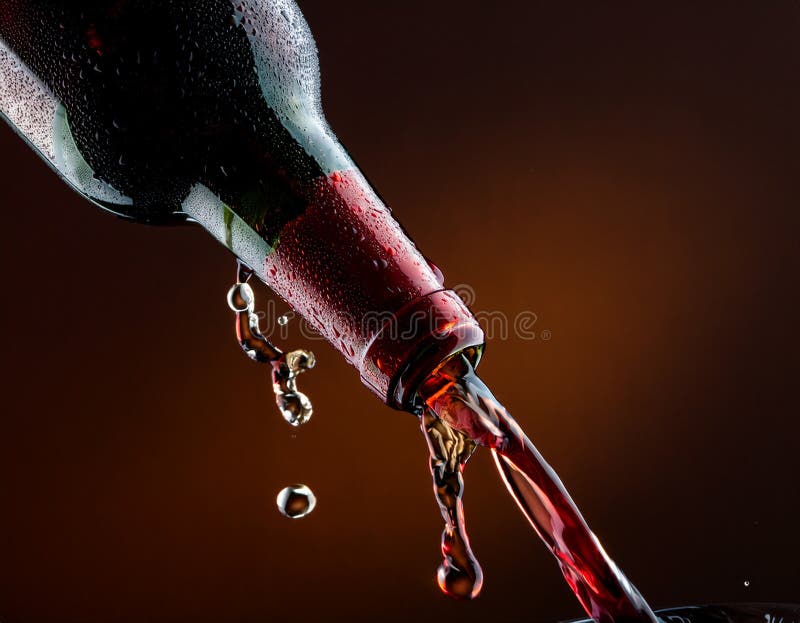 Wine Drops Falling from a Tilted Bottle Captured Mid-action To ...