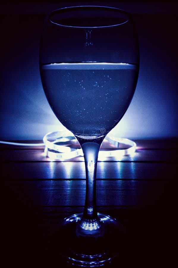 Wine Glass Filled with Water Illuminated by Led Lights Stock Image ...