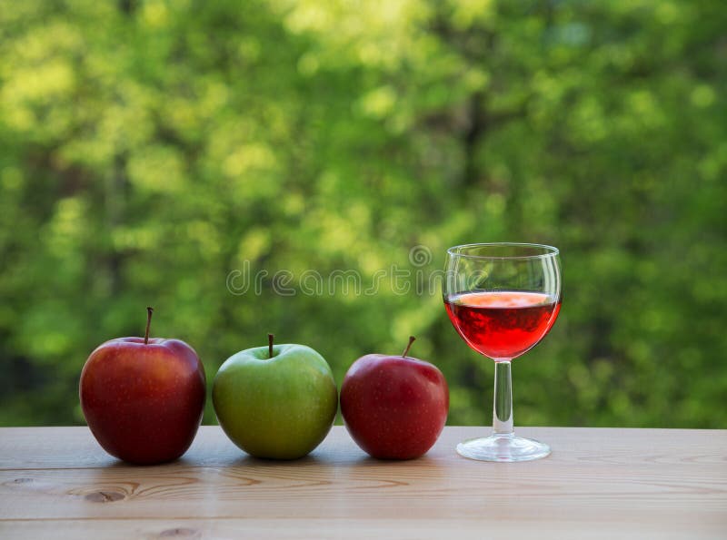 Wine Glass Red and Green Apples on Table Stock Image - Image of ...