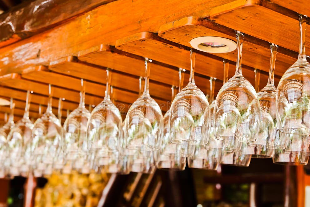 Wine glasses in a bar stock photo. Image of beverage - 26264002