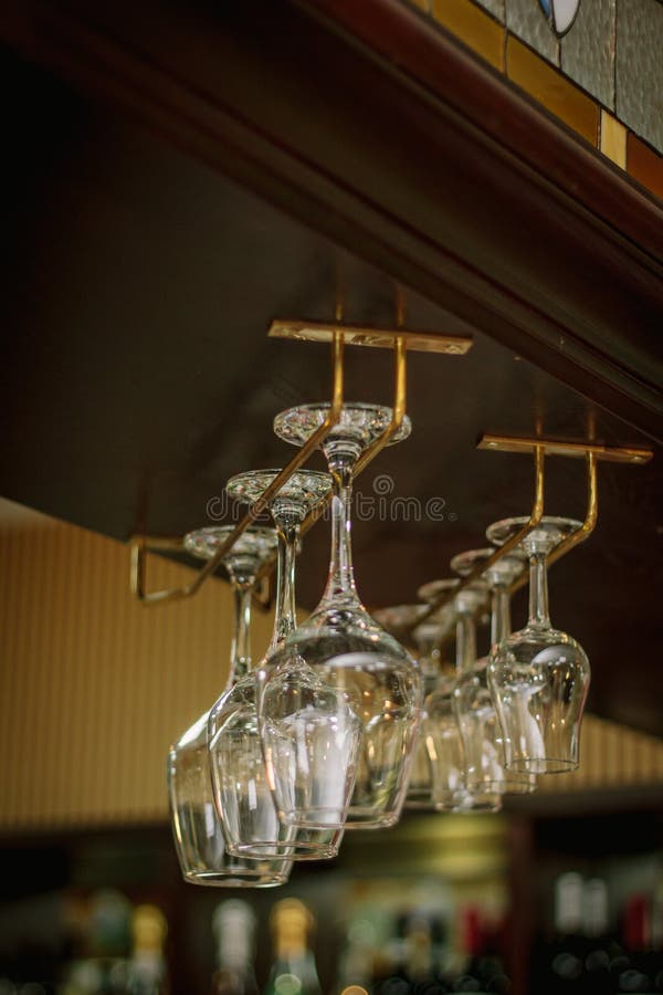 Wine Glasses in a Bar on Wooden Rack. Stock Image - Image of light ...