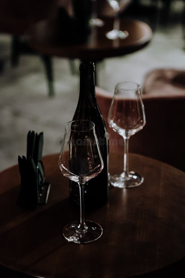 Wine Glasses and Bottles of Wine in the Entourage of the Wine Bar Stock ...