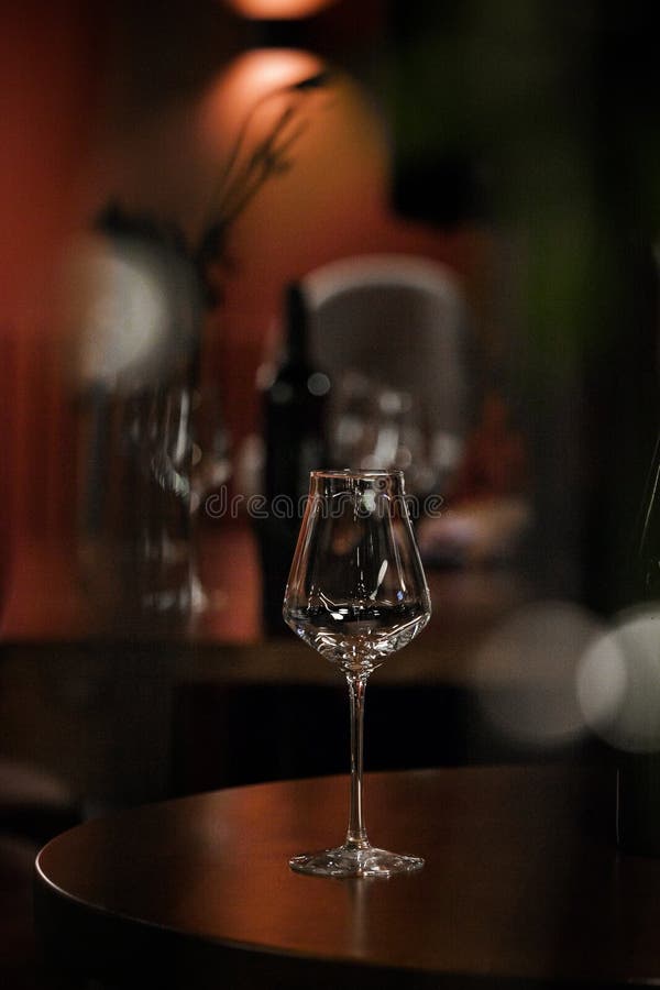 Wine Glasses and Bottles of Wine in the Entourage of the Wine Bar Stock ...