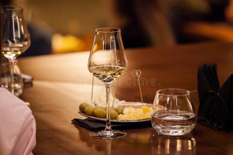 Wine Glasses and Bottles of Wine in the Entourage of the Wine Bar in ...