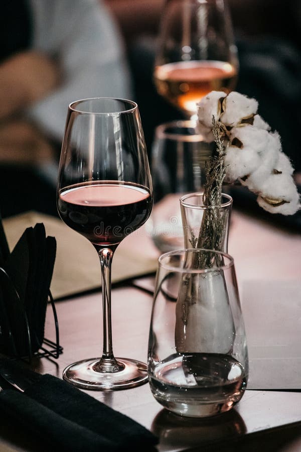 Wine Glasses and Bottles of Wine in the Entourage of the Wine Bar in ...