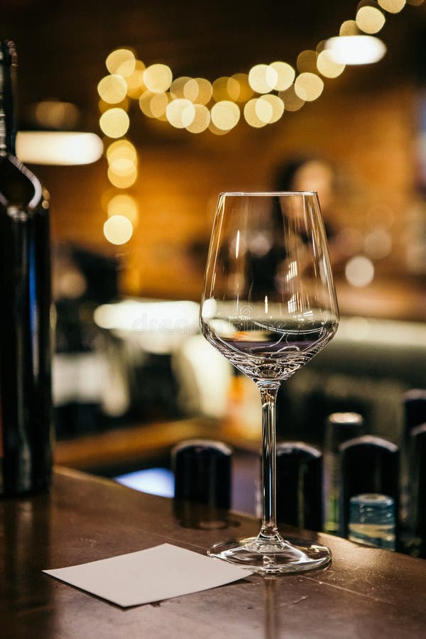 Wine Glasses and Bottles of Wine in the Entourage of the Wine Bar in ...