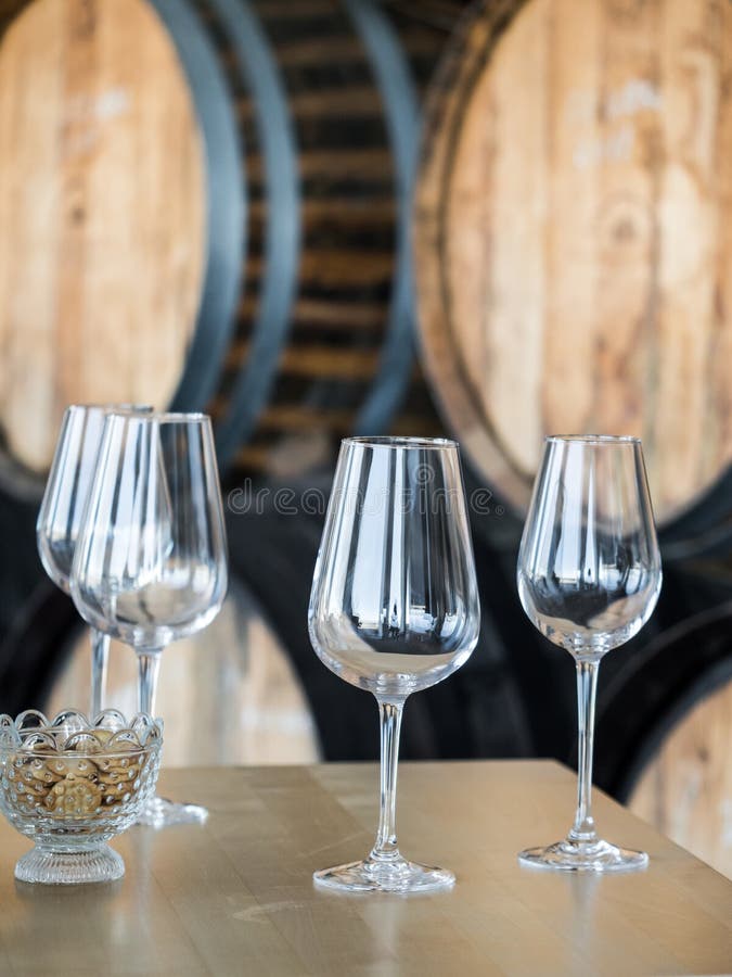 Wine Glasses in Front of Wooden Wine Barrels Stock Image - Image of ...