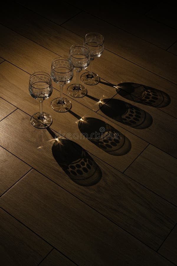 Wine Glasses and Shadow from Glasses on a Wooden Surface Stock Image ...