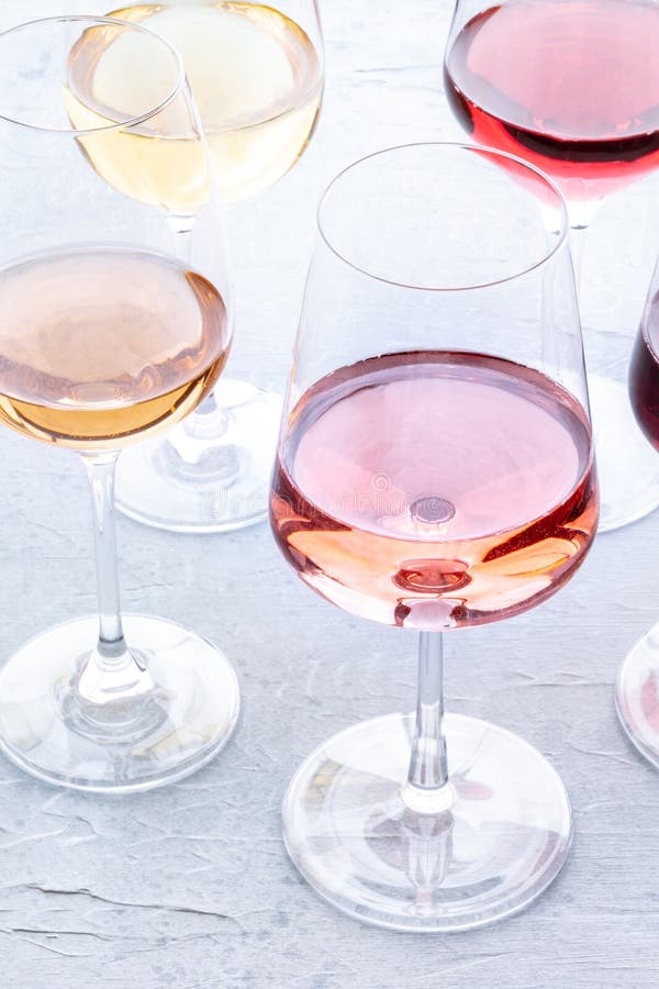 Wine Glasses at a Tasting. Rose and White Wines, Drinks on a Table ...