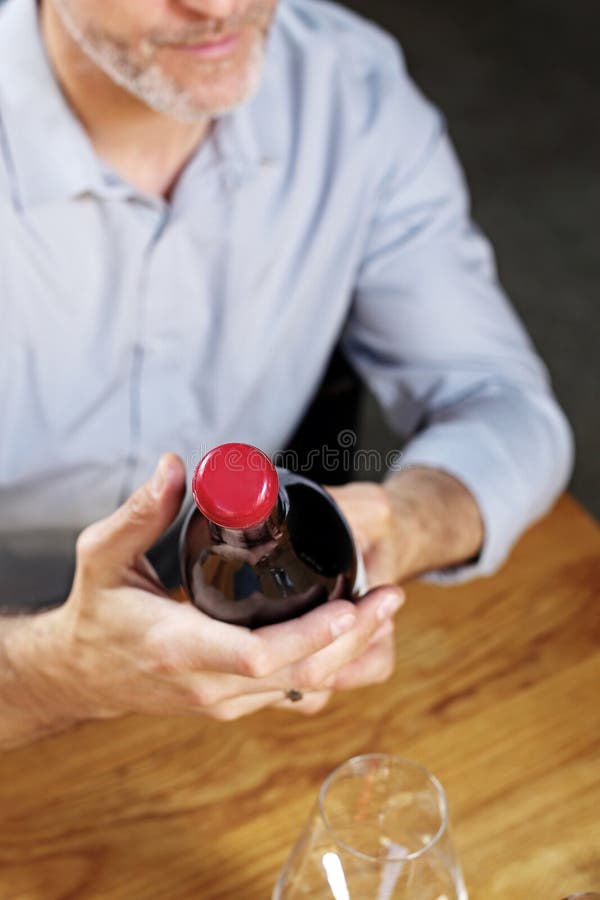 Wine Selection. Man Reading a Label on a Bottle Stock Photo - Image of ...