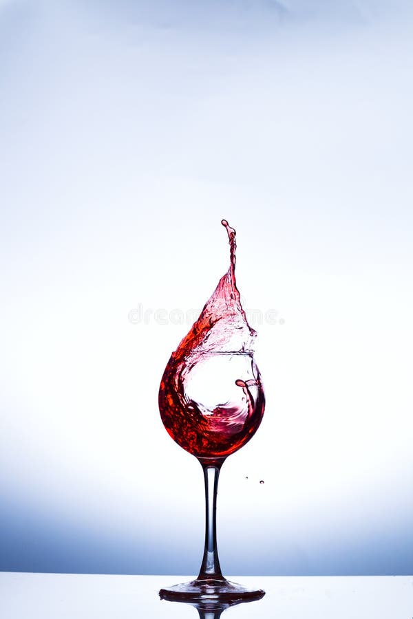 Wine splashing in glass stock photo. Image of light, abstract - 82785880