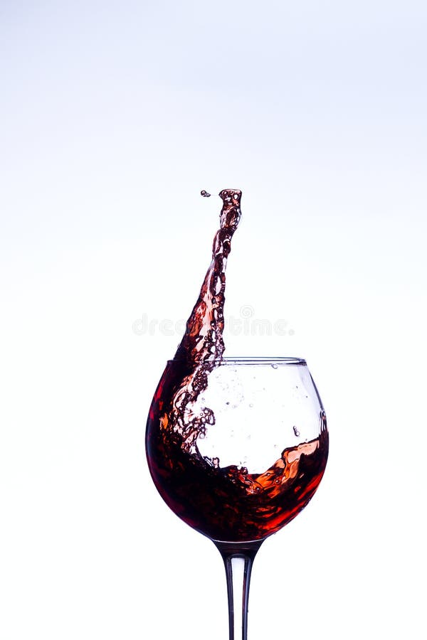 Wine splashing in glass stock photo. Image of scarlet - 82785922