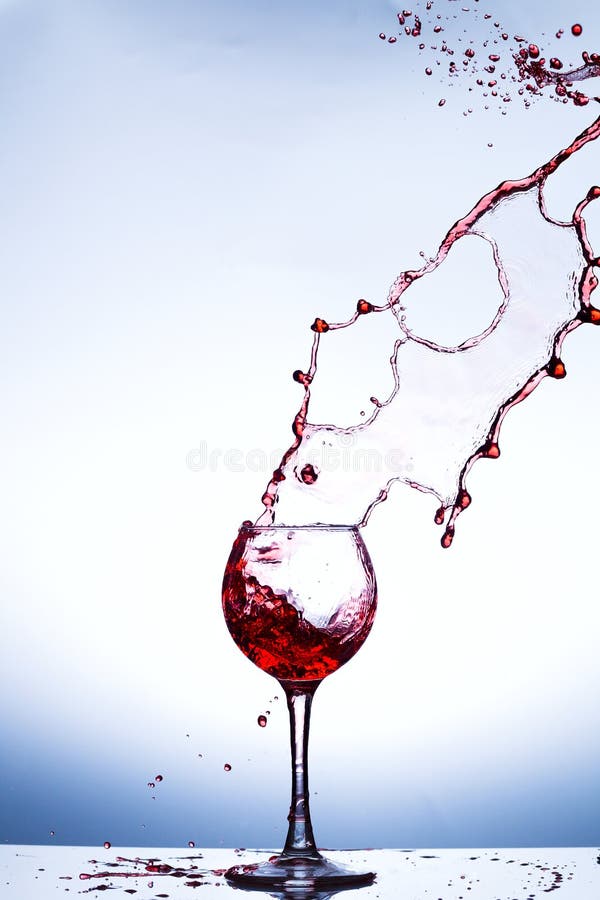 Wine splashing in glass stock photo. Image of goblet - 82786004