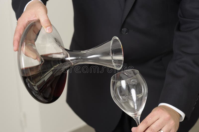 Wine Waiter Decantering a Bottle of Red Wine Stock Photo - Image of ...