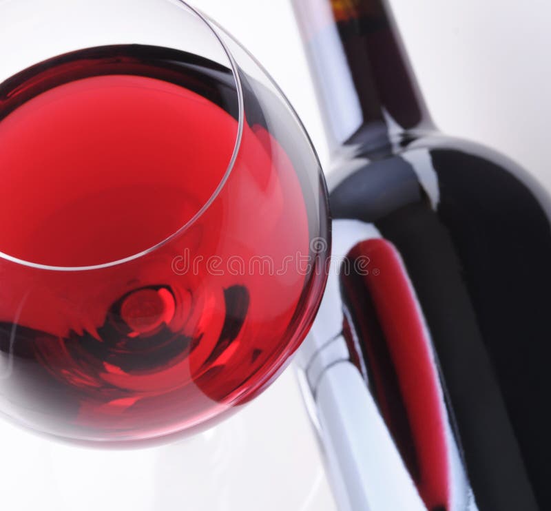 Wineglass with Reflection in Bottle Stock Image - Image of side ...