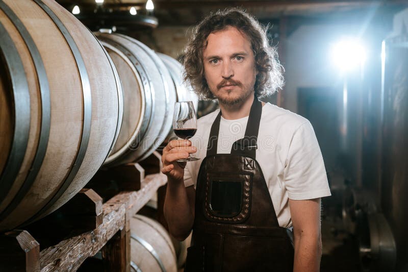 Winemaker Inspecting Red Wine in Cellar Stock Photo - Image of rustic ...