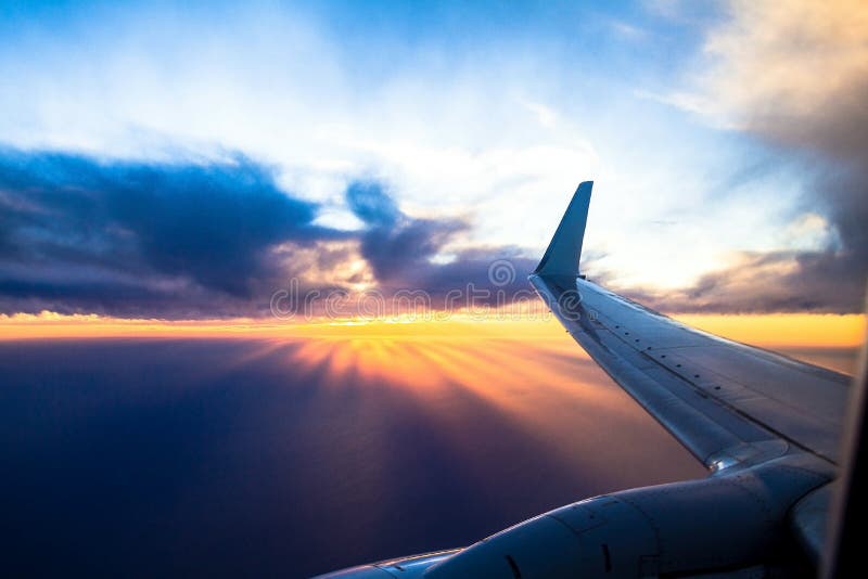 Wing aircraft at sunset. stock photo. Image of blue, atmosphere - 66248962