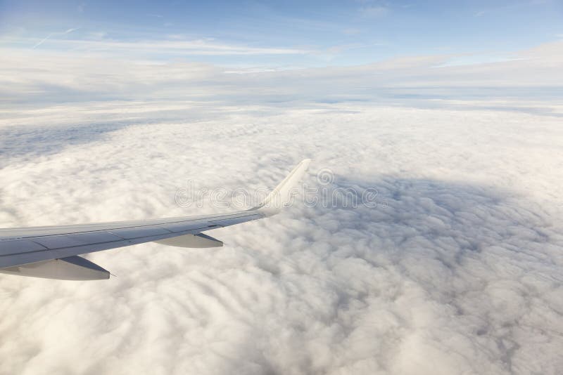 Airplane Wing Over the Clouds Stock Image - Image of flying, travelling ...