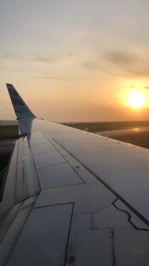 Sunset stock image. Image of wing, sunset, view, airplane - 221968799
