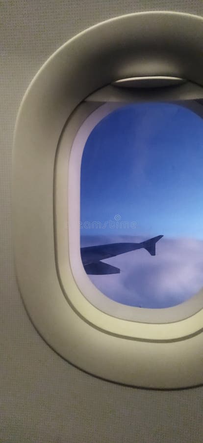 The Wing of an Airplane in Flight Seen from the Window Stock Photo ...