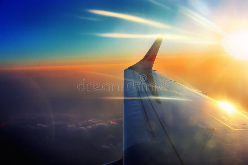 Wing of the Airplane in Flight in Sunrise Beams Stock Image - Image of ...