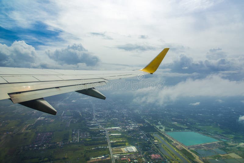 Wing of an Airplane Flying Above the Clouds Stock Photo - Image of ...
